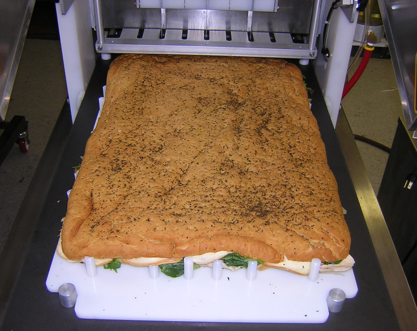 Cutting A Full Sheet Sandwich With A FoodTools Machine